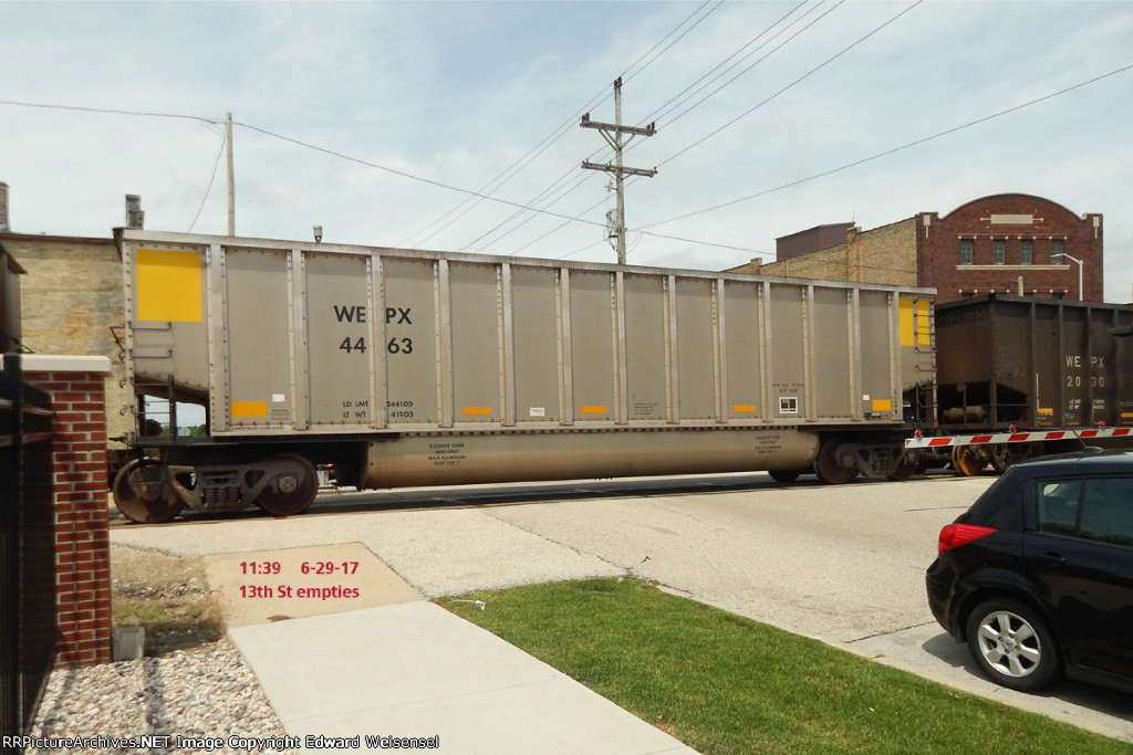 Twin-rotary gon mid-train with WEPX empties @ 13th St.