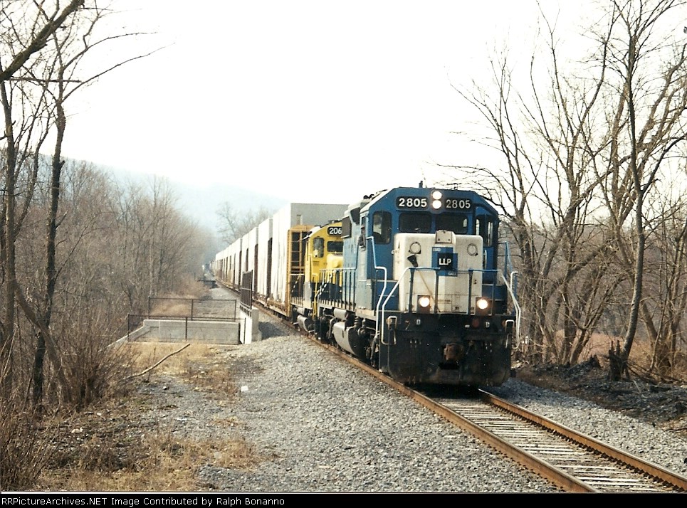 BH-1 with a leased SD38 leading, heads north for the Utica Main