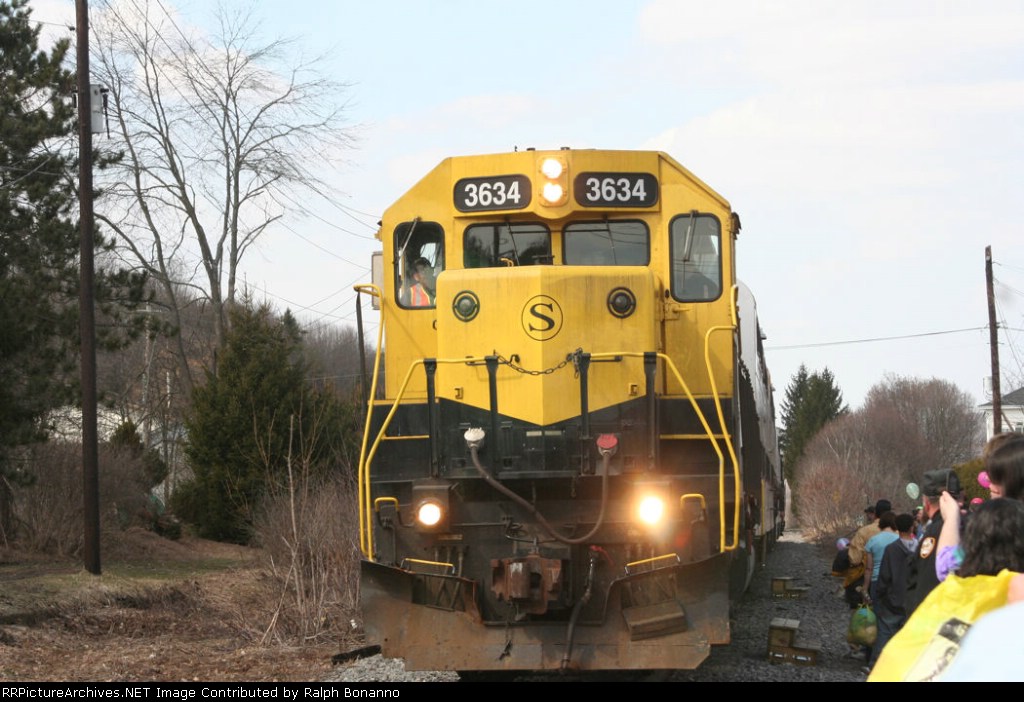 Engineer Leon Smith guides the 3634 past the crowds as the shuttle train from Cortland arrives ...