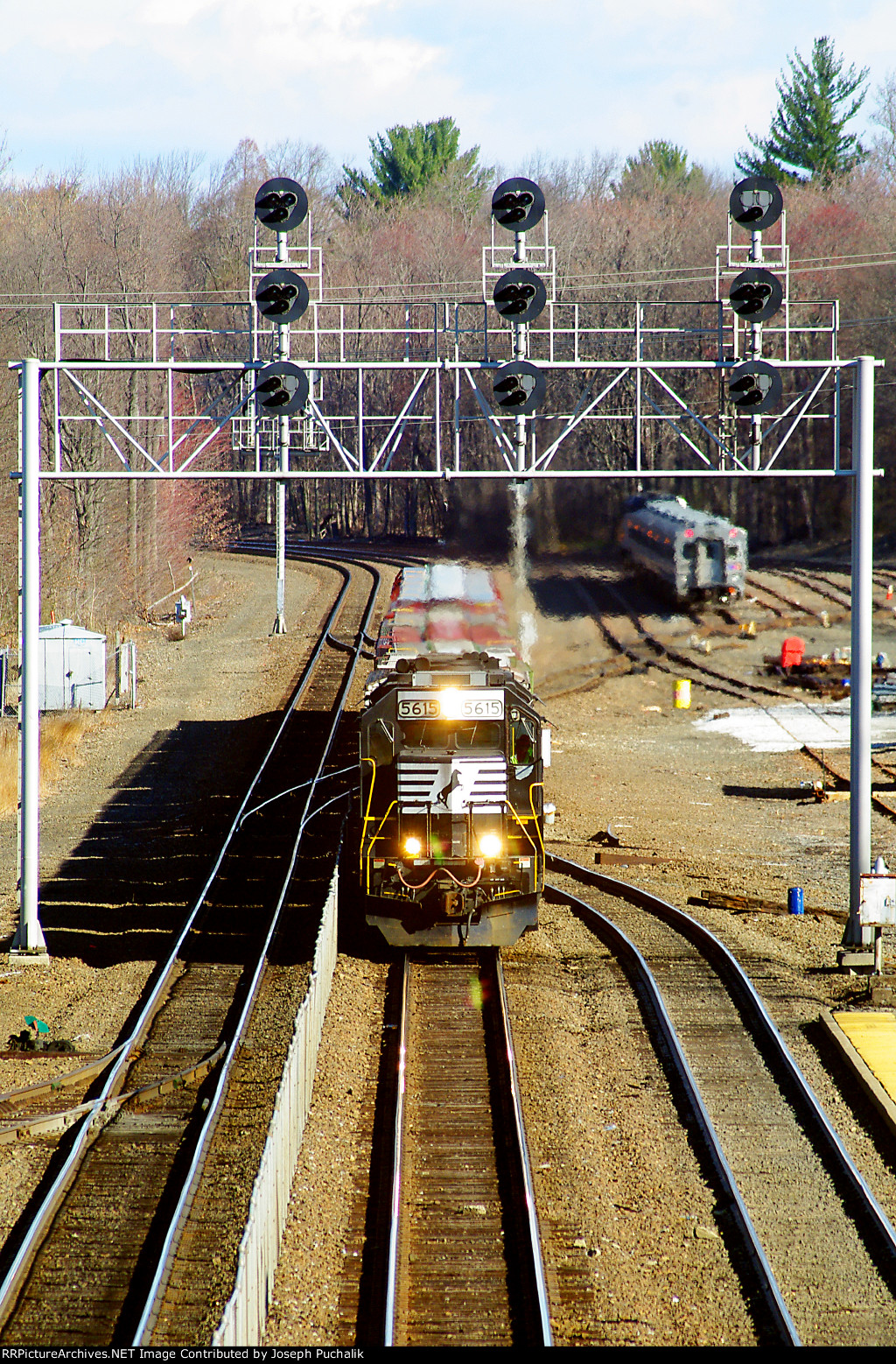 NS H55 passing under the signal bridge at Waldwick Station