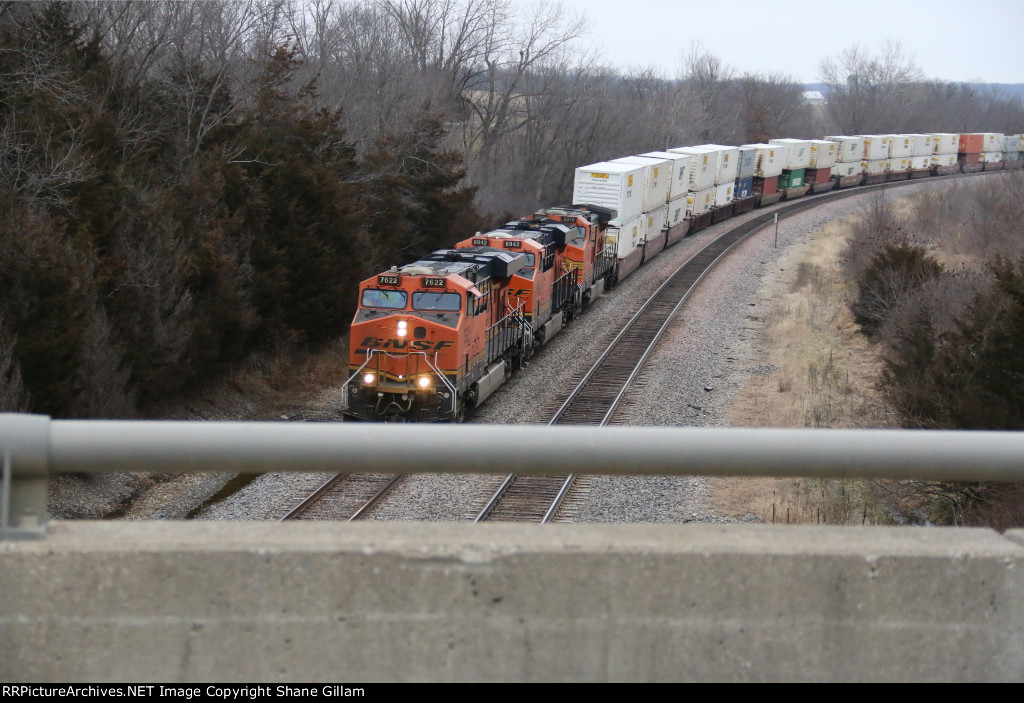 BNSF 7632 Races west with a stack train behind it.