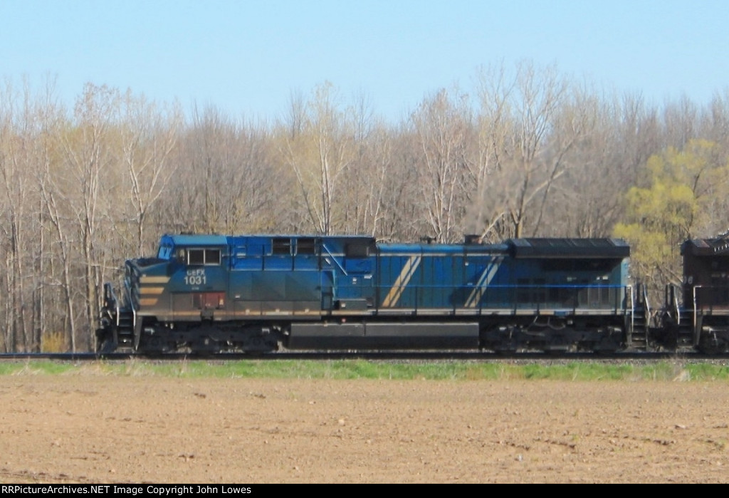 Westbound CP mixed freight running through the countryside