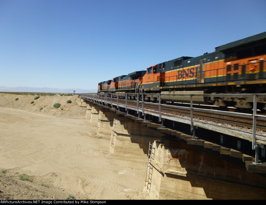 BNSF westbound at large bridge east of Cadiz