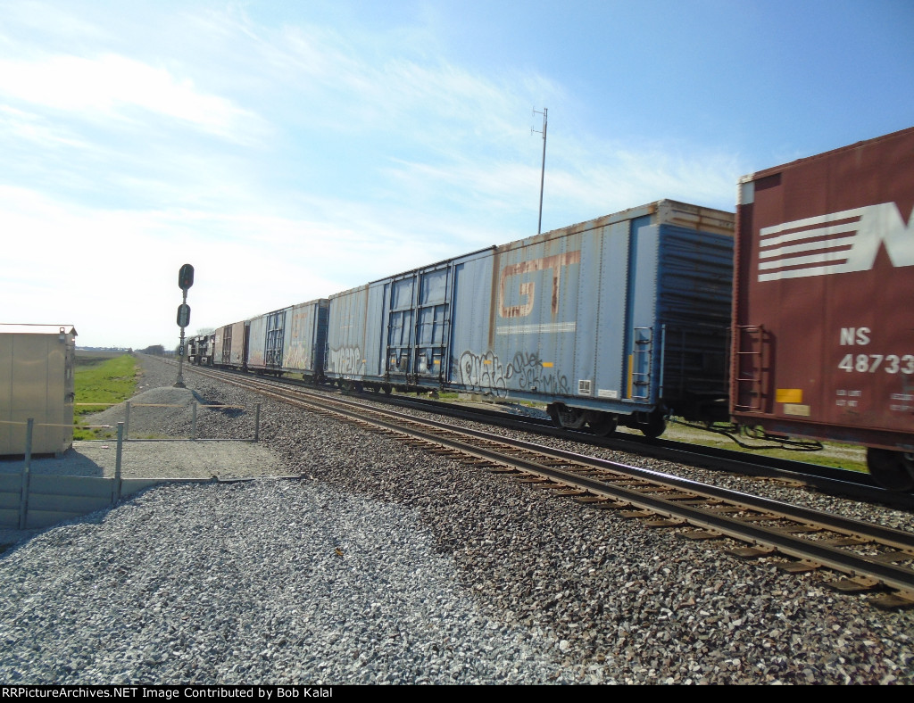 NS 7567 Westbound with GT Boxcars in tow