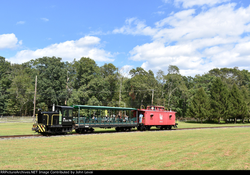 USAX Tonner # 7751 leading its train through the field of Allaire State Park.