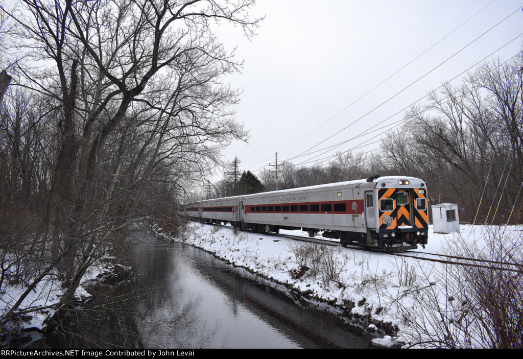 Ex-NJT Comet 1 Cab Car # 5119, still showing the tiger stripes, trails the train through ...