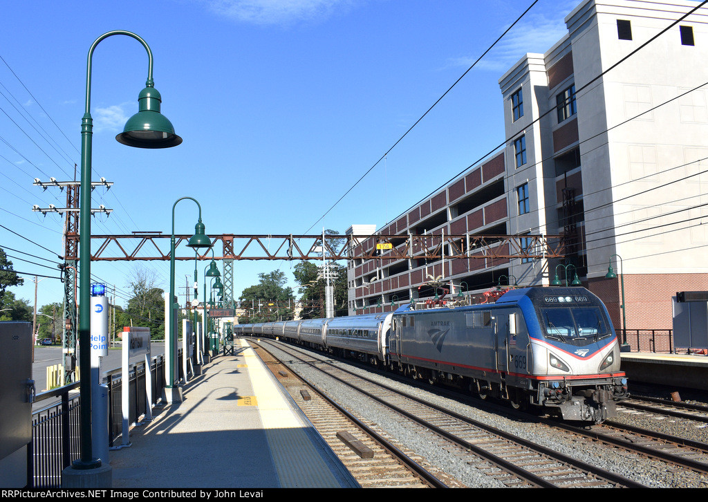 Amtrak Northeast Regional Train # 135 runs express through Harrison with ACS-64 # 669 in the lead