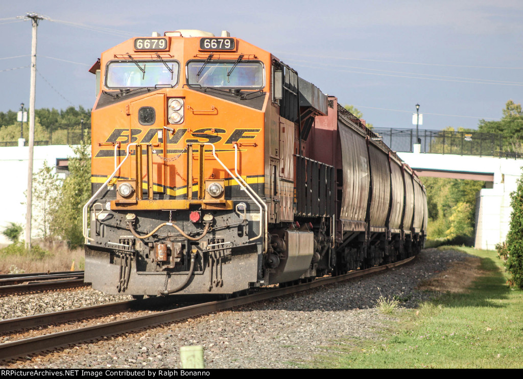 BNSF 6679 brings up the rear on an eastbound grain train