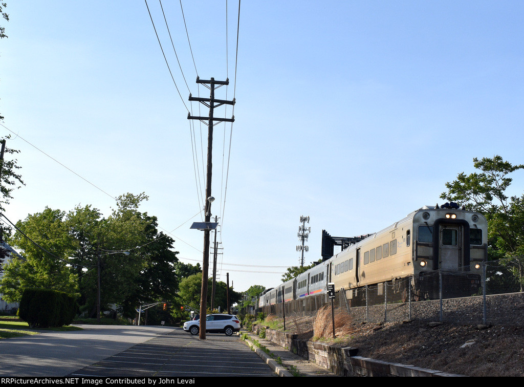 Eastbound NJT Train # 1274 departs Broadway-Fair Lawn Station which is toward the rear in this ...