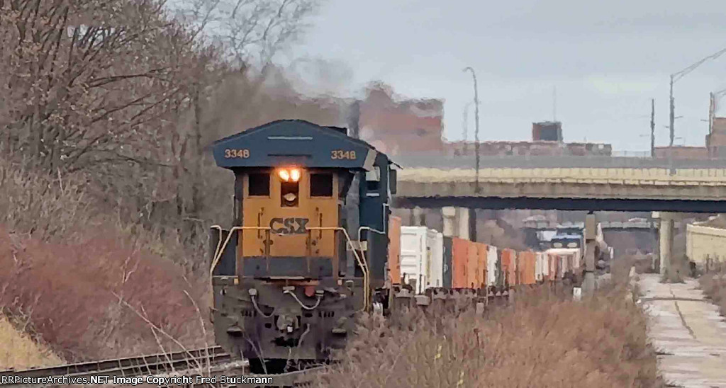 CSX 3348 keeps an eye on the train it's shoving.