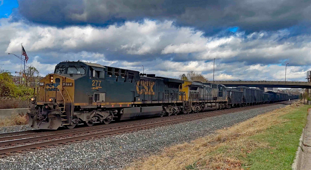 CSX 277 leads B157, loaded Coke.