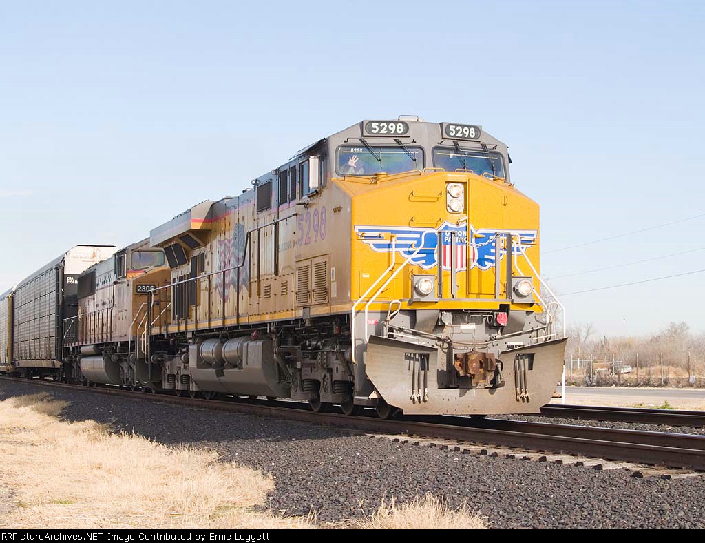 UP 5298 leads an empty EB autorack at 8:52am
