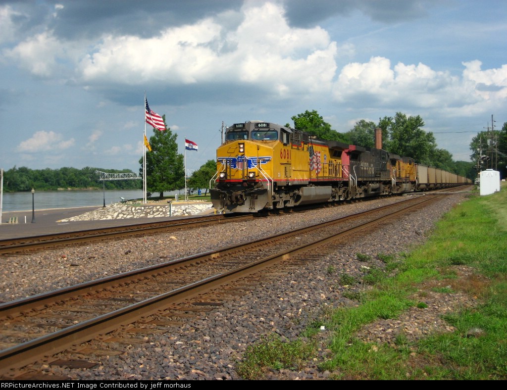 UP 6081 WB empty following the Missouri River with Hwy 47 Bridge in the background