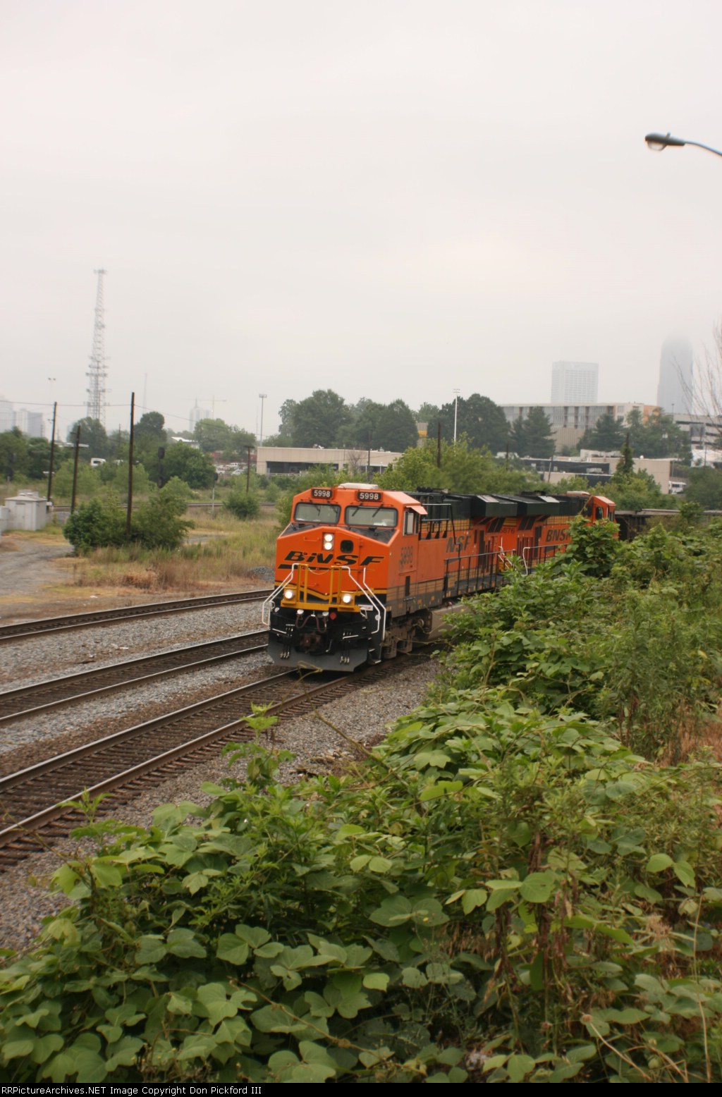 BNSF 5998 Heads back north with a string of empty coal hoppers