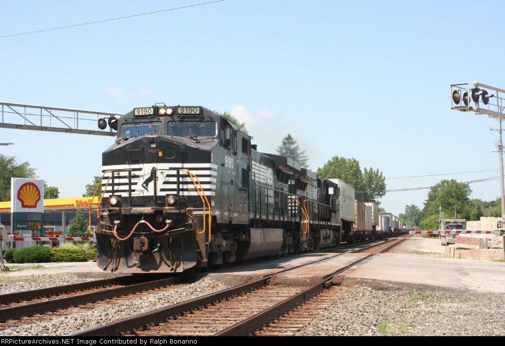 Eastbound van train rolls through town. Look at the price of gas... UGH!