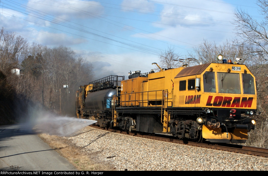 588 - Loram rail grinder RG318 in the curve at the power plant.