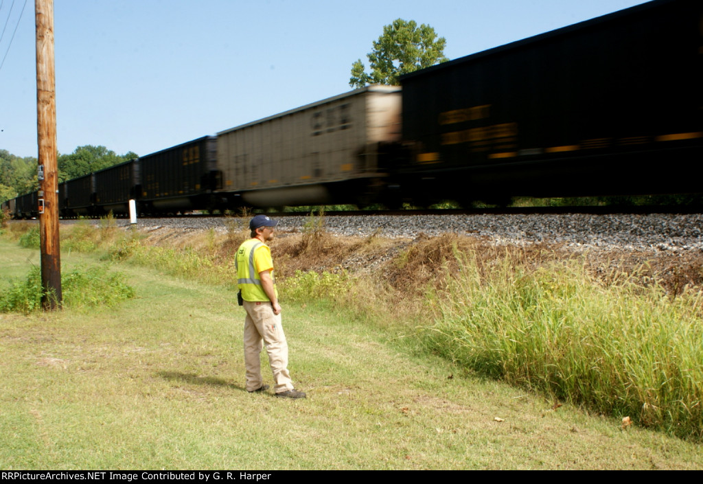 471 - Conductor on H744 inspects passing coal train
