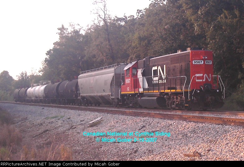 South bound CN train waits on the main track for North Bound Amtrak pass on the siding
