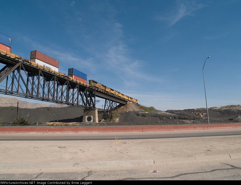 UP 7711 leads a WB doublestack across the Rio Grande Bridge at 1:45pm
