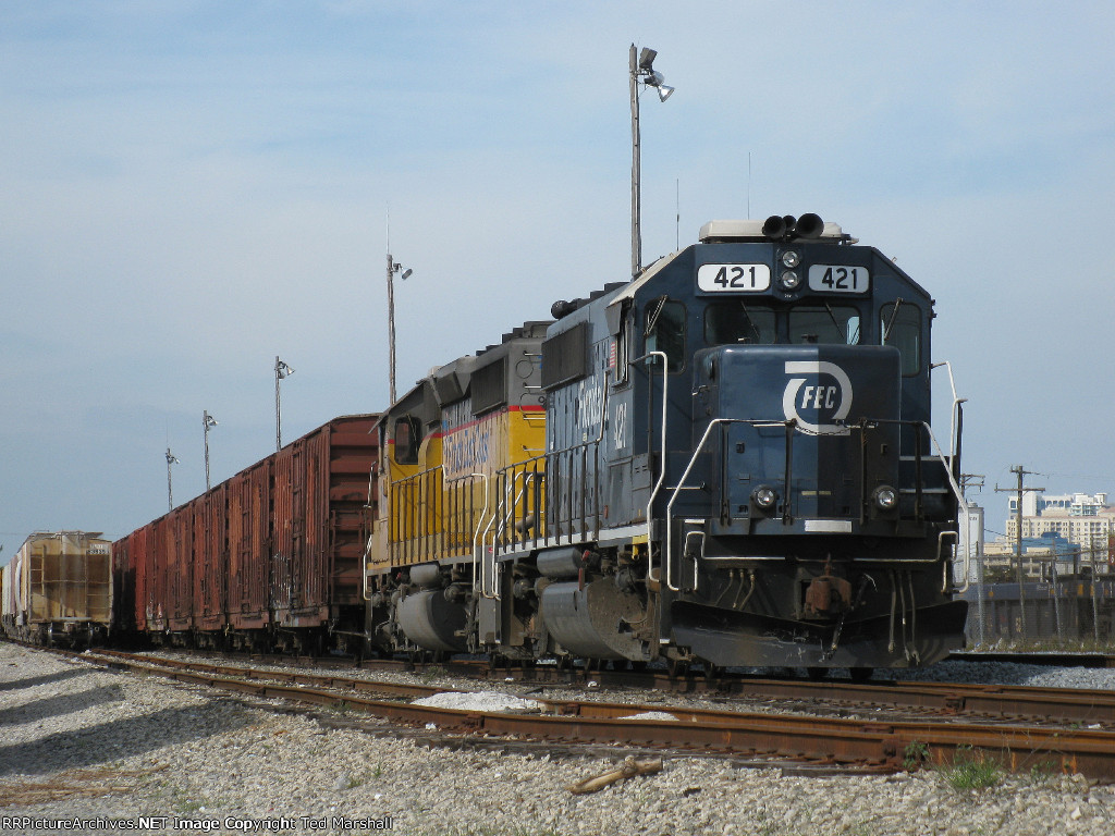 FEC Train 222 gets the high-green on the siding