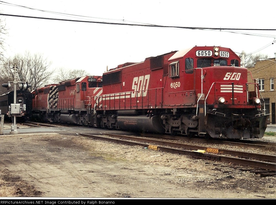 An eastbound detour train with CP/SOO power rolls over Rochelle Avenue