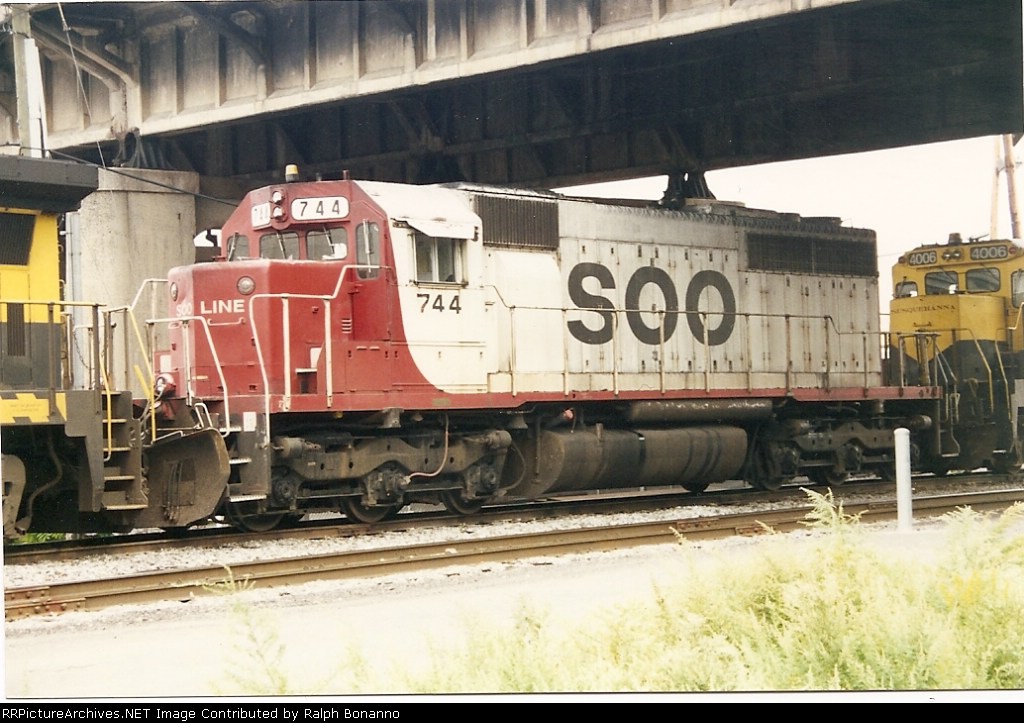 A pair of B40-8's sandwich this SD40 under Route 46 on the service track