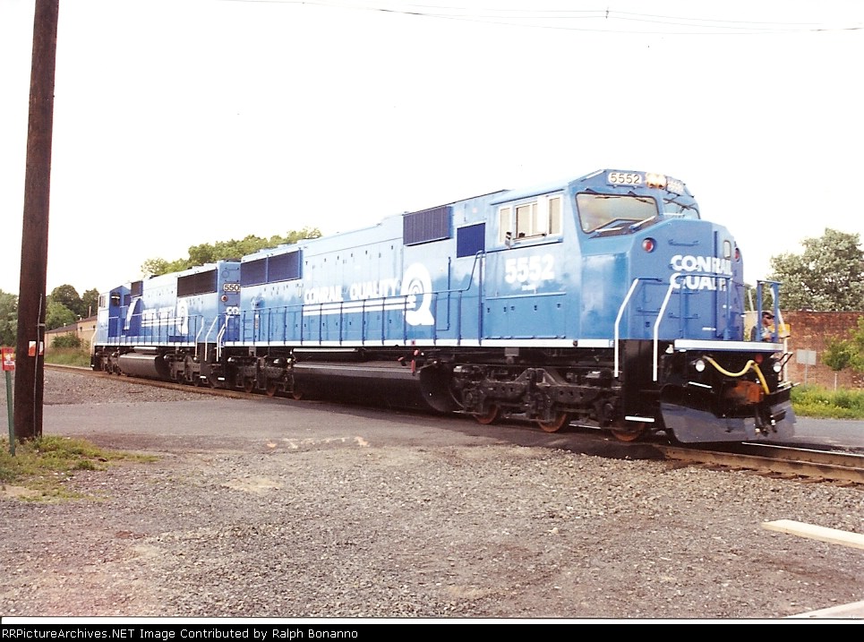 Lite power in the form of a pair of SD60Ms rolls south at Bergen Tpke on the River Line