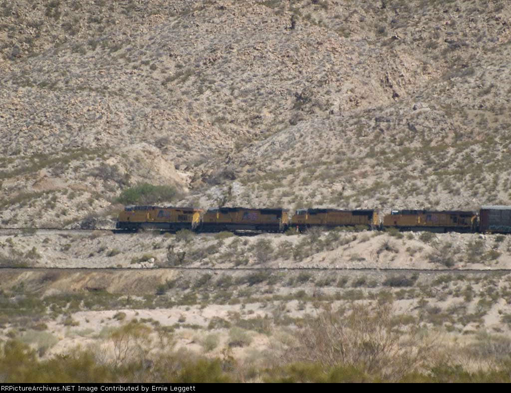 UP 7796 decends the grade towards El Paso leading an EB autorack/doublestack at 1:56pm