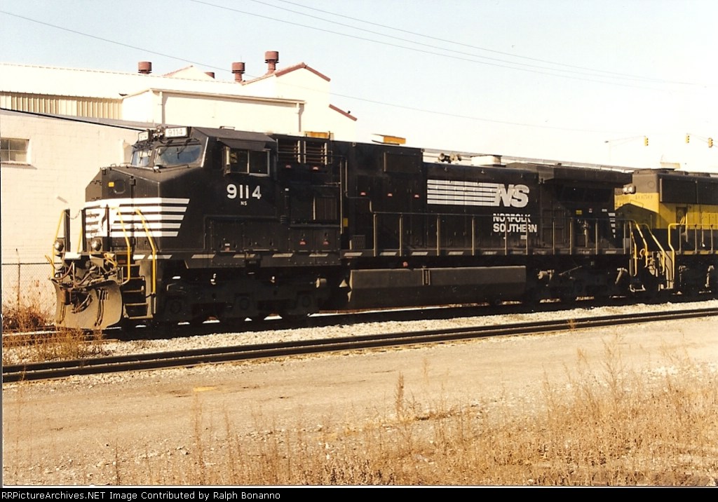 NS dash 9 # 9114 and SD70 4050 sit at the east end of the fuel track