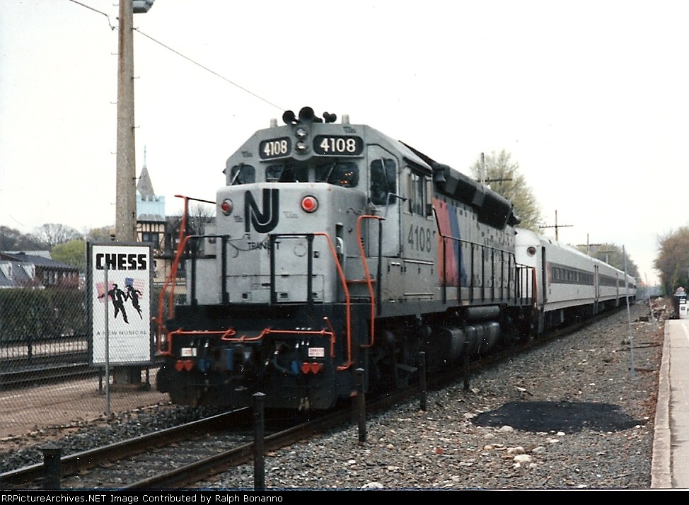 GP40P 4108 heads west in "push" mode through the center track in the station