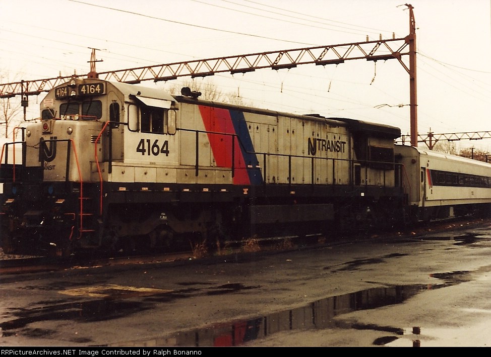 U34CH 4164 sits in the yard on layover between runs on a damp afternoon