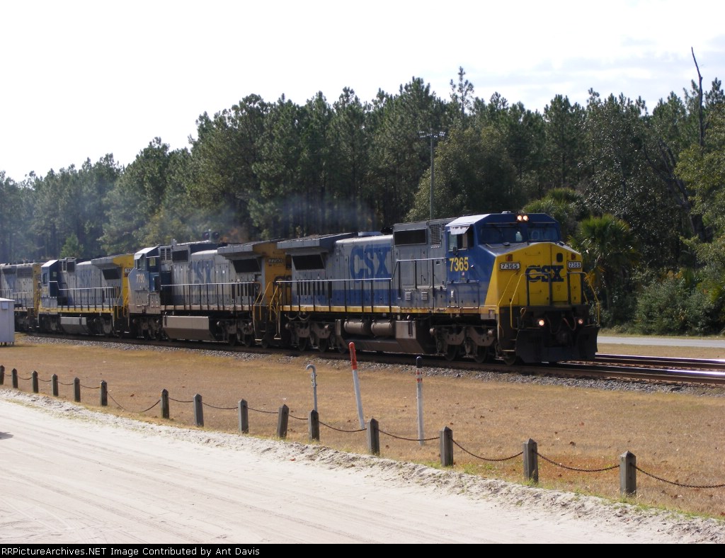CSX 7365 with some old power behind it!