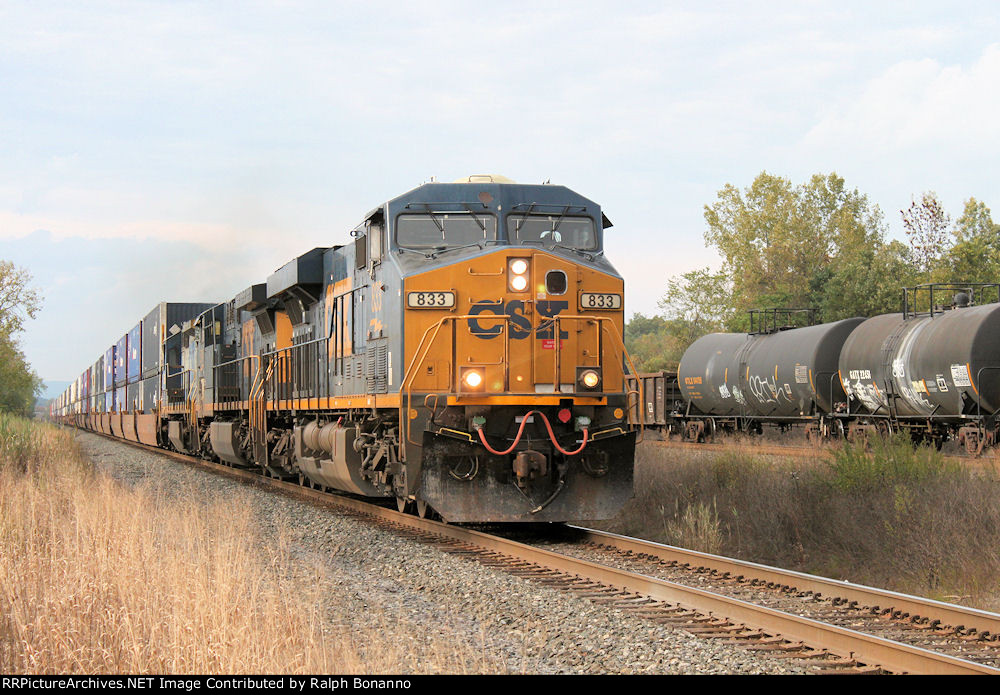 CSXT Q004-29 rolls into view at Stone rd as Q351-30 passes in the background