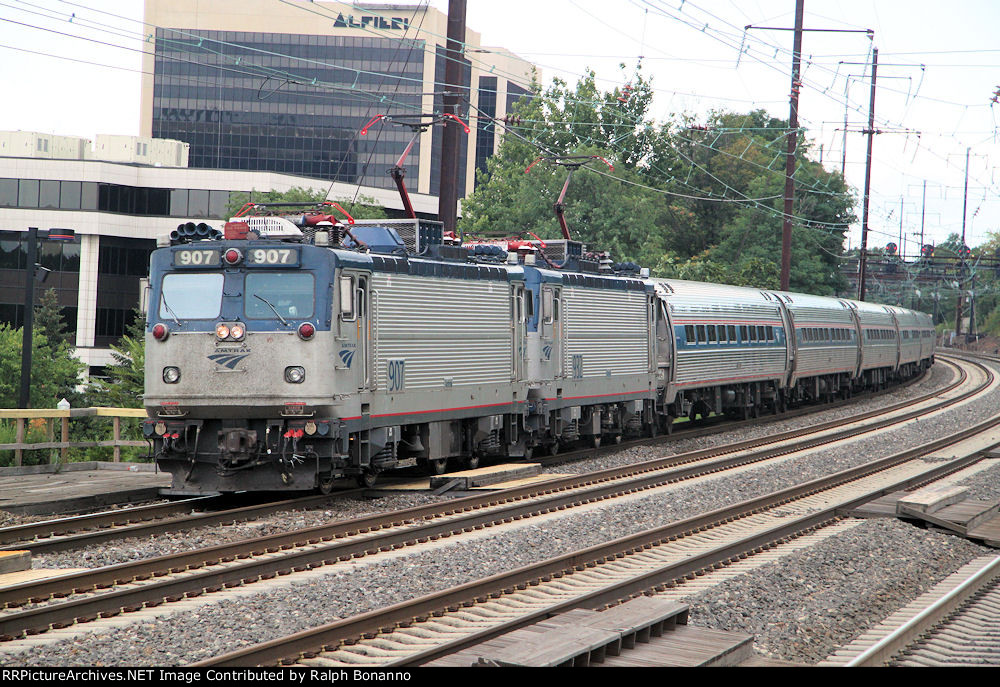 Double headed AEM-7's lead a NY-bound Amtrak train into the station