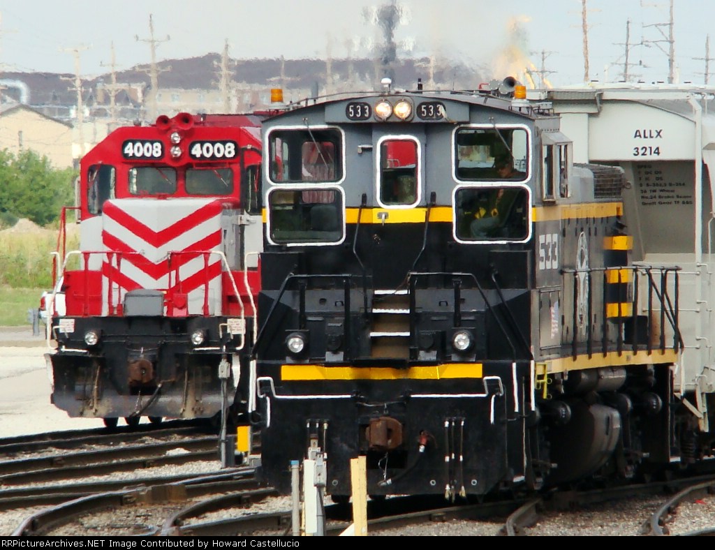 BRC 533 with a cut of cars for the west dept yard passes WSOR SD40-2 # 4008