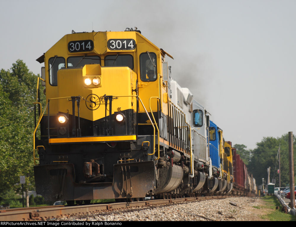 Westbound road freight SU-99 storms thru town at dinner time on a hazy July afternoon enroute to ...