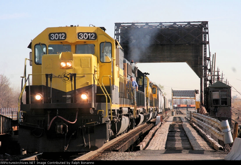 As one crew member walks forward, NYS&W train SU-99 starts its journey west to Binghamton NY.