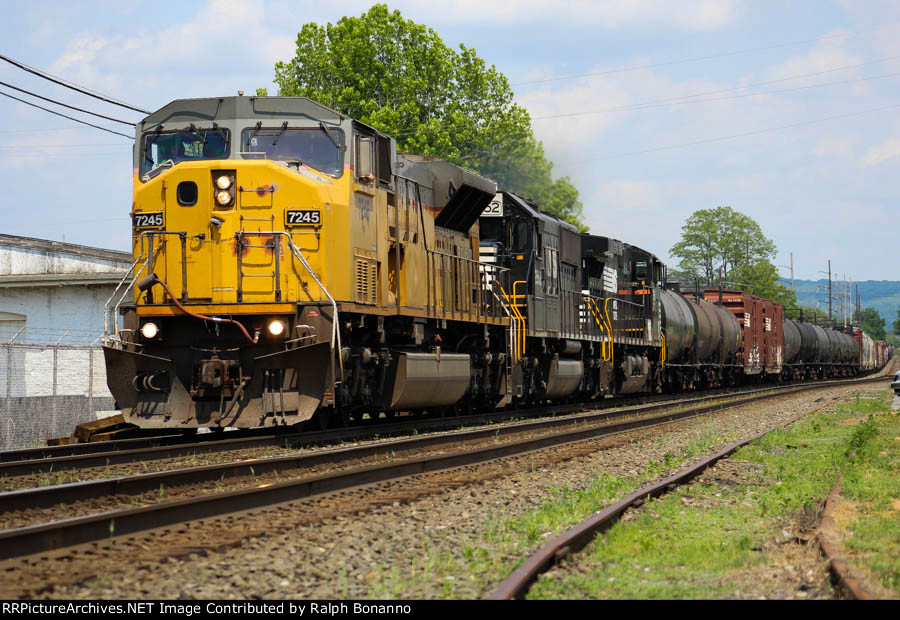 An ex UP SD90MAC heads up westbound 38G on a hazy saturday afternoon