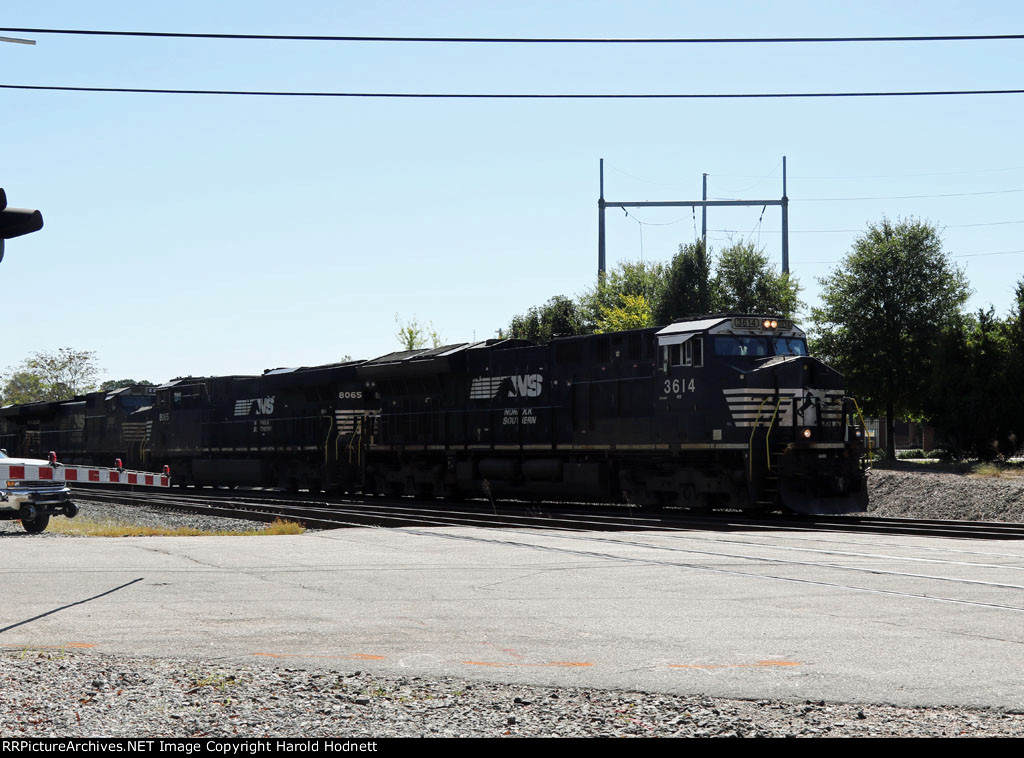 NS 3614 leads train 60U across Cabarrus Street
