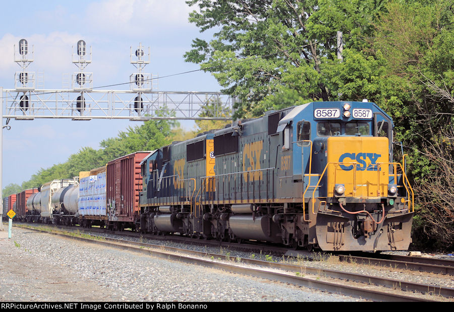 A pair of standard cab SD50's lead westbound tonnage at Columbus Ave