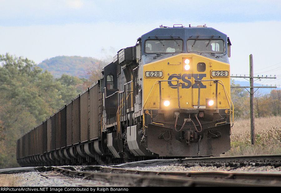Westbound empty hoppers behind AC60 628 climb the grade to CP West Lagrange