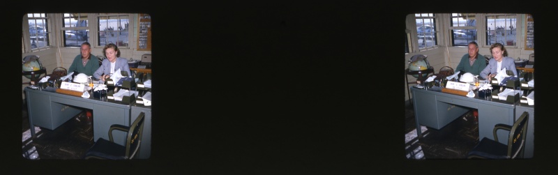 Man and Woman Sit at Colonel David Schilling's Desk | Harry S. Truman