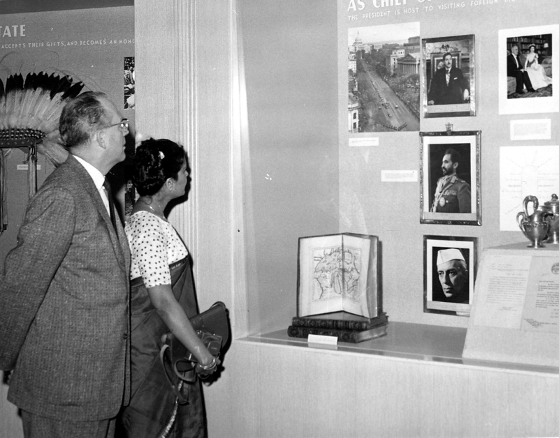 A man showing a woman a museum case at the Truman Library | Harry S. Truman