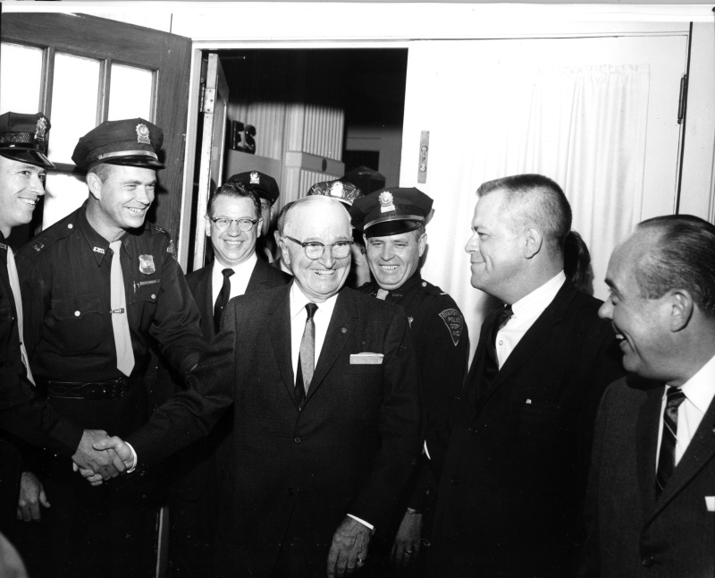 Former President Truman with police escort and dignitaries at the ...