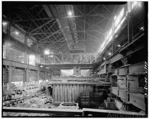 41. 44-INCH SOAKING PITS. A MORGAN CRANE LOWERS THE STEEL... Photo