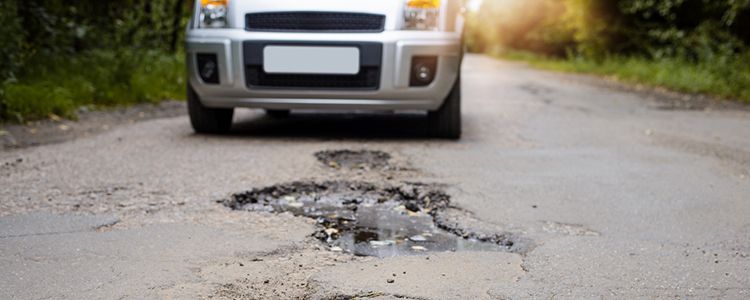 Does Insurance Cover Pothole Damage? | SmartFinancial