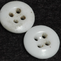 Ceramic button fragment · ANTH 1130