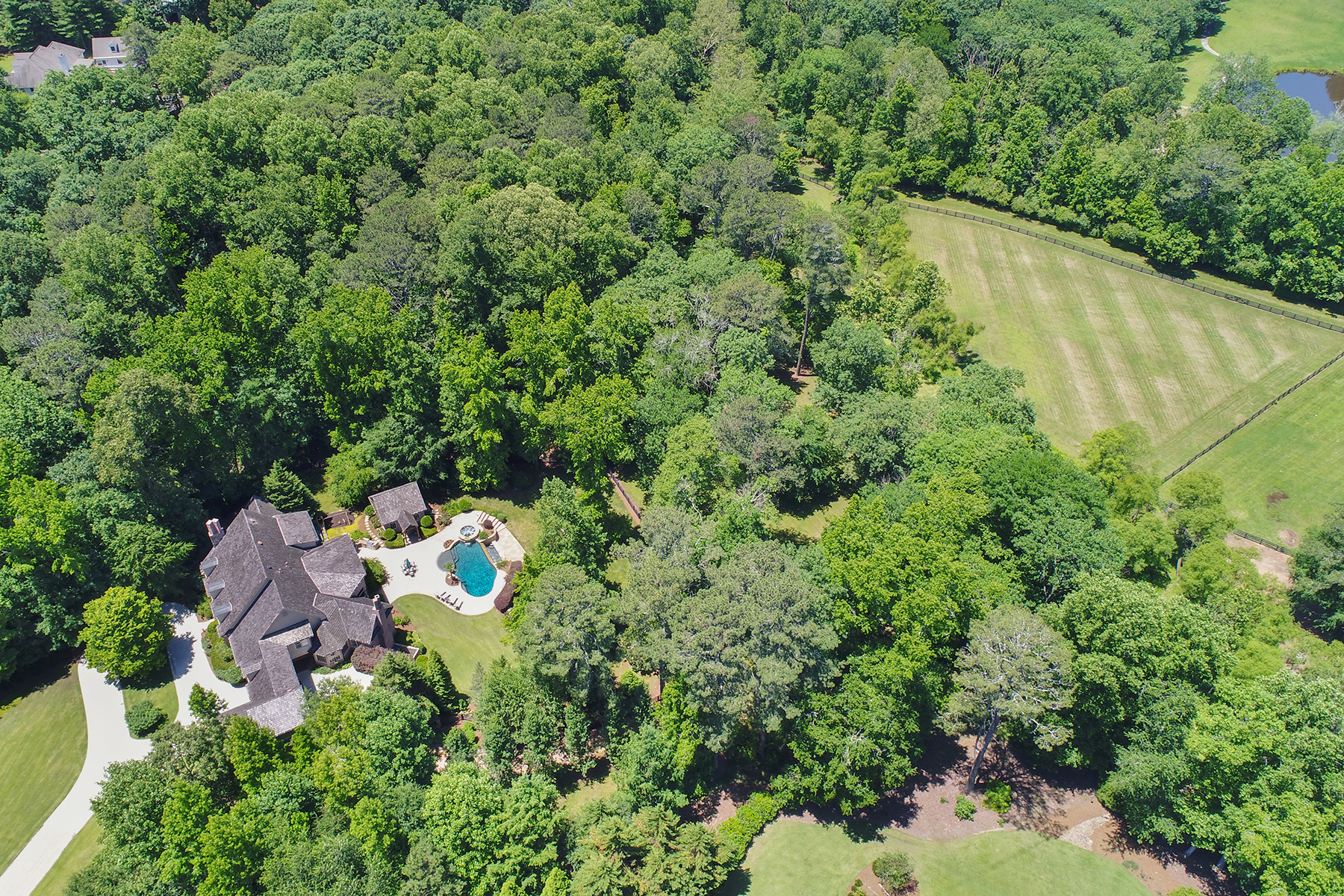 Expansive Estate with Acres of Rolling Pasture and Infinity Edge Pool ...