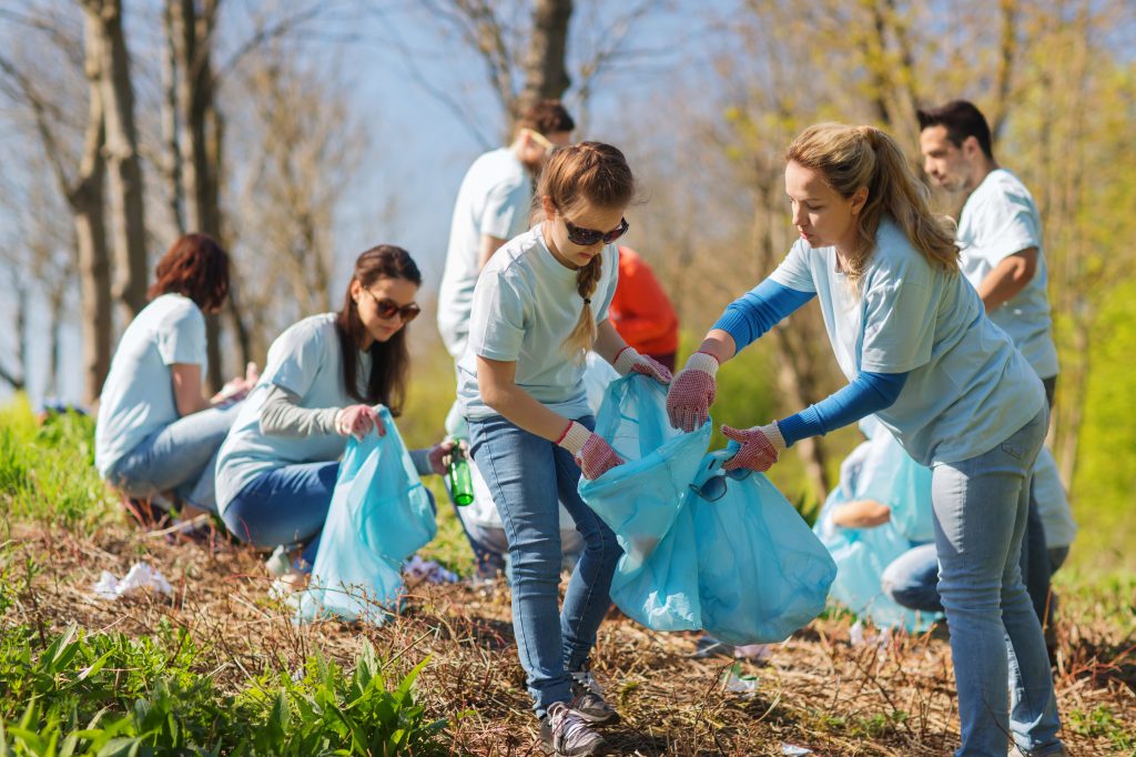 volunteers with garbage bags cleaning park area – Brown Trail Church of ...