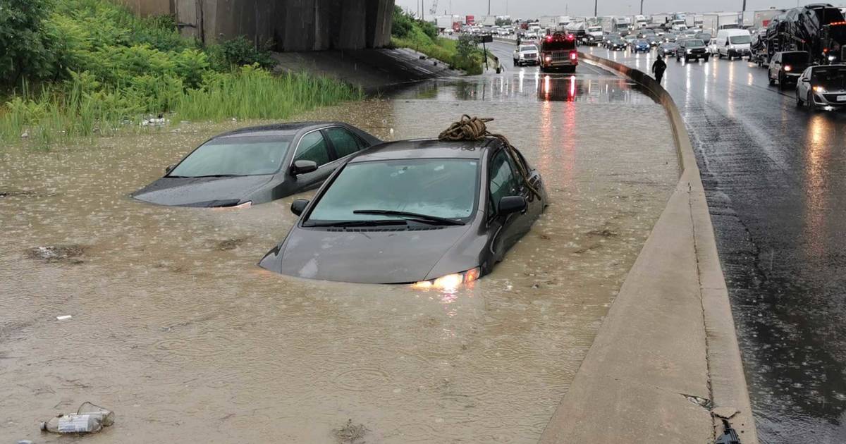 Cars underwater as torrential downpour floods Toronto streets